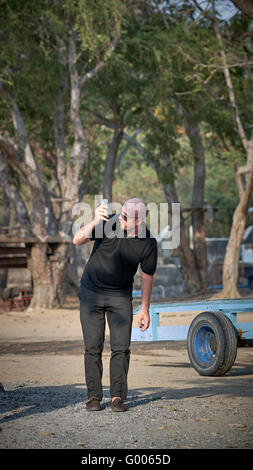 People take photos with their mobile phones of seagulls flying around ...