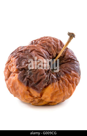 Yellow dry rotten unhealthy apple on a table. Unhealthy unhygienic ...