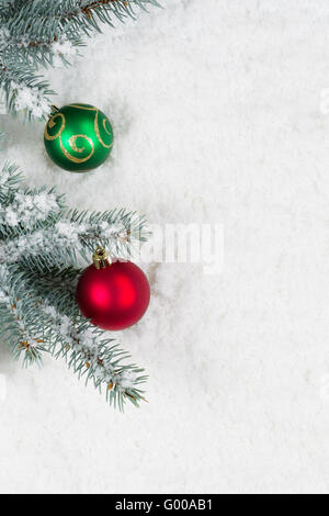 Decorated Christmas tree with ornaments and pine cones against a ...