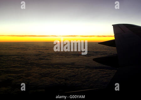 Airliner plane flying into the sunset. Flugzeug fliegt in den ...