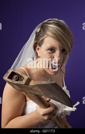 angry young bride with an axe on a dark blue background Stock Photo - Alamy