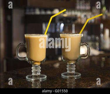 Two cups of coffee with milk on a tray Stock Photo - Alamy