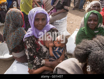 Ethiopia, Semien Wollo Zone, Woldia, ethiopian people wait at a food ...