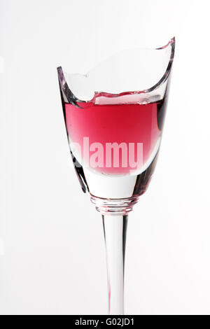 Broken wineglass on the table. Poured red wine, like blood Stock Photo ...