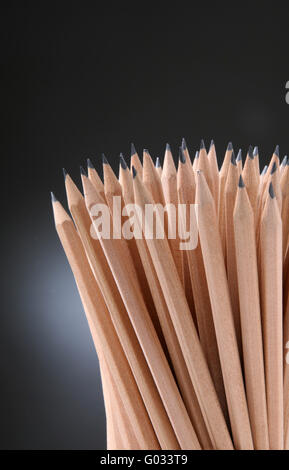 A bunch of graphite black pencils for drawing and single large ...