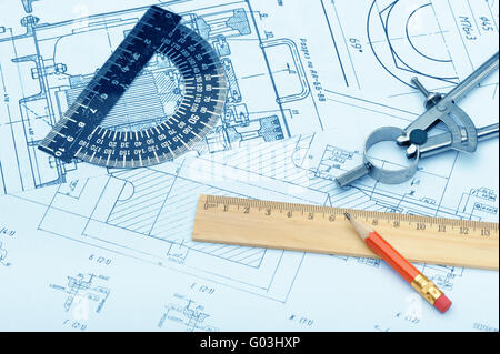 The plan industrial details, a ruler, caliper, divider and a red pencil ...