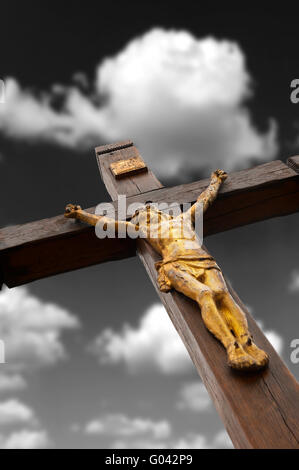 The crucifixion from a tree with Jesus's gilt figure Stock Photo - Alamy