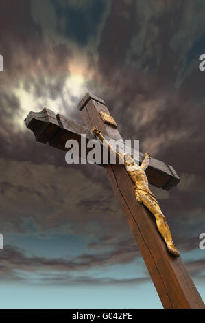 The crucifixion from a tree with Jesus's gilt figure Stock Photo - Alamy