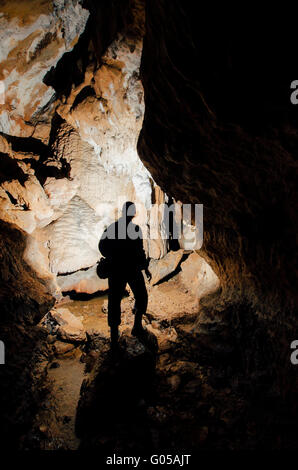 man exploring dark cave Stock Photo: 103380300 - Alamy
