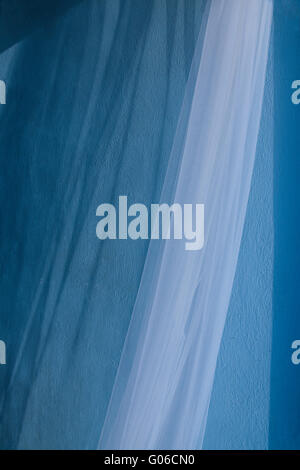 Sheer white curtains blowing in wind Stock Photo - Alamy