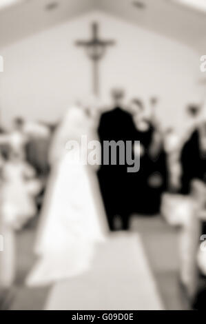 Couple standing before the priest for wedding ceremony outdoors in the ...