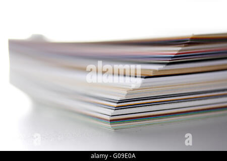 separating stacked sheets to organize a folder with white background ...