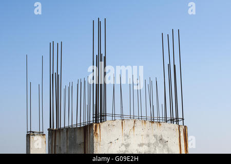 Reinforced steel bars are protruding from the concrete pillar Stock ...
