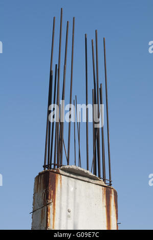 Reinforced steel bars are protruding from the concrete pillar, detail ...