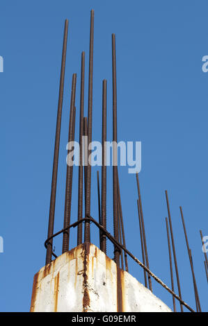 Iron and steel reinforcement protruding from the wall of a demolished ...
