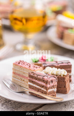 Small cakes with different cream Stock Photo - Alamy