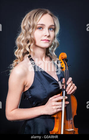 Beautiful violin on dark background Stock Photo - Alamy