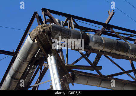 Engineering power pipeline is lifted over soil Stock Photo - Alamy