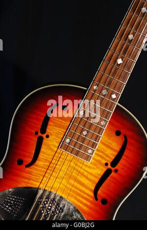 Playing resonator guitar with a slide Stock Photo - Alamy