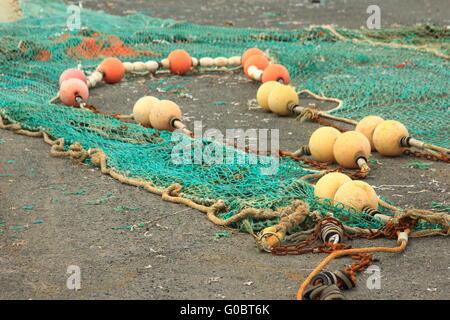 Fishing nets spread on the ground Stock Photo - Alamy