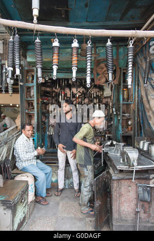 Local Indian mechanic pose for camera the street of Old Delhi in India ...