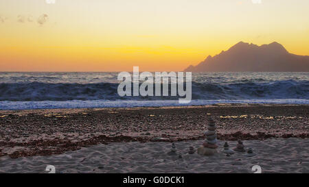 Surging billow in the afterglow at the beach Stock Photo - Alamy