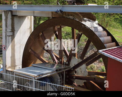 Modern water wheel to generate electricity Stock Photo - Alamy