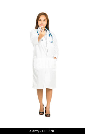 Smiling female doctor in white coat posing in clinic office Stock Photo ...