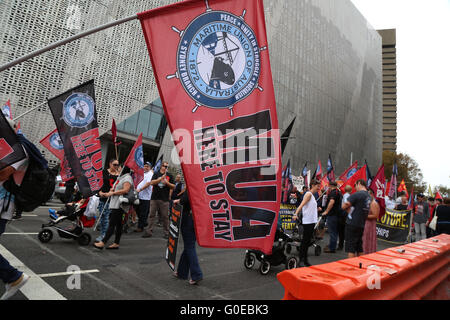 A Maritime Union of Australia flag is held by a member during a union ...