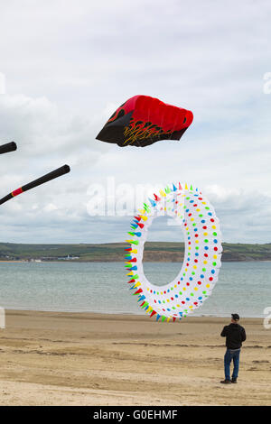 Man with ring circular kite with coloured spikes flying at the Weymouth ...