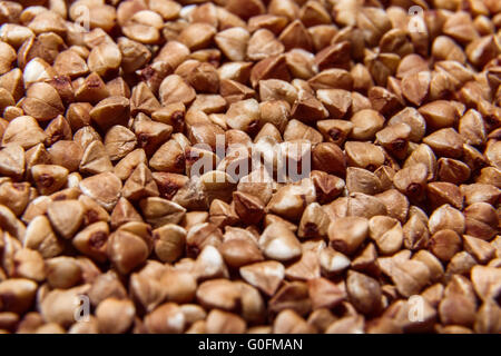 Uncooked buckwheat closeup macro isolated Stock Photo - Alamy