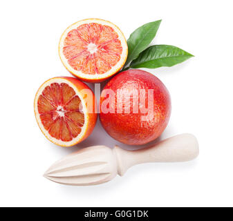 Fresh oranges juicer juice tropical fruits and herbs on concrete board ...