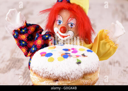 sweet donut at carnival with clown Stock Photo - Alamy