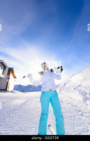 Portrait of a pretty and active woman skier, wearing a mask, active ...