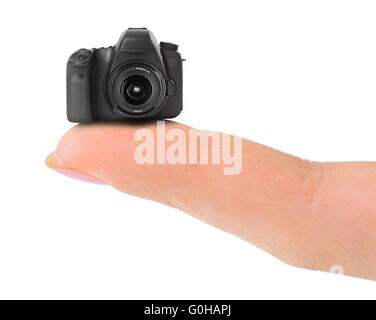 Hand holding a spy camera isolated on white background. Black security ...