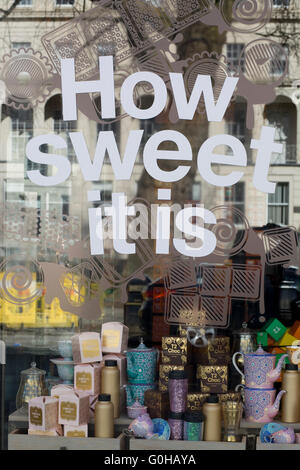 Shop window with Sale lettering and facade of the boutique of the ...