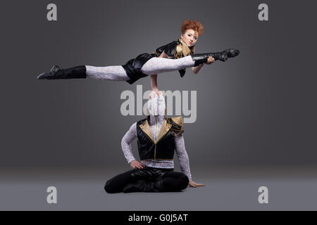Image of go-go dancers posing in acrobatic pose Stock Photo - Alamy