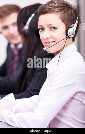 smiling callcenter agent with headset support hotline Stock Photo - Alamy