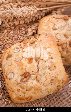 Appetizing fresh white baguette bread on a wooden background with ...