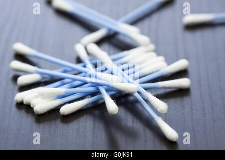 Random pile of blue plastic cotton ear buds for cleaning wax out of the ...