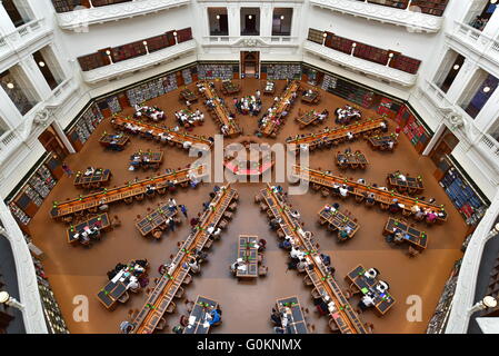 Australia Melbourne: State Library of Victoria. Visitor studying at ...