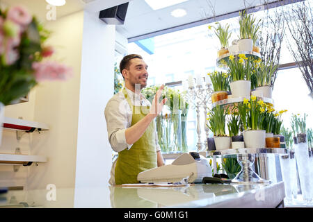 florist man or seller at flower shop counter Stock Photo - Alamy