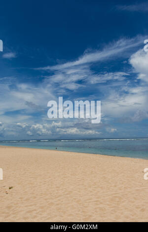 Beautiful tropical beach with lush vegetation Stock Photo - Alamy