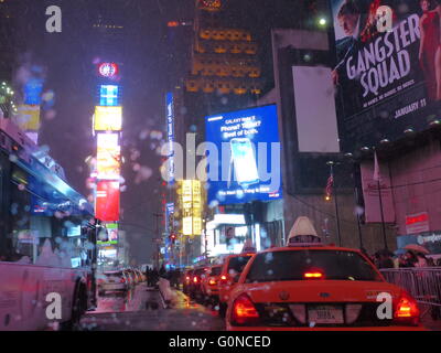 Snow falling on Times Square in New York, NY on February 22, 2026 as ...
