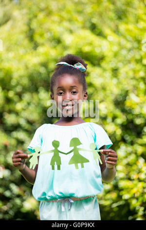Portrait of cheerful girl holding paper cloud copy space isolated over ...
