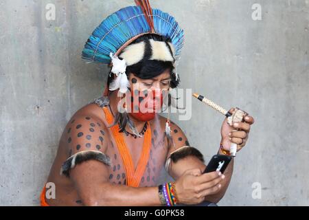Brazilian indigenous torch carriers prepare for their turn as the ...