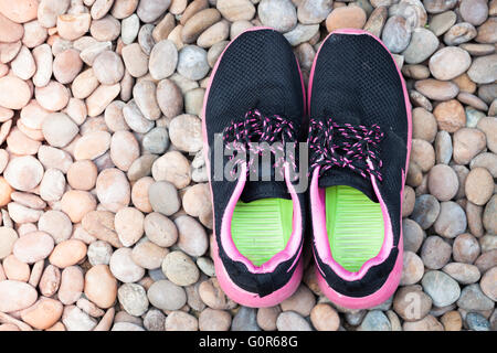Running shoes in home garden on pebbles, stock photo Stock Photo - Alamy