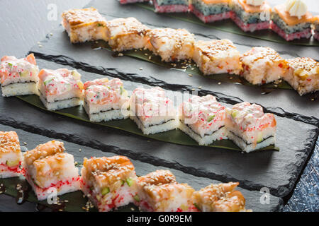 set of sushi on a slate square plate Stock Photo - Alamy