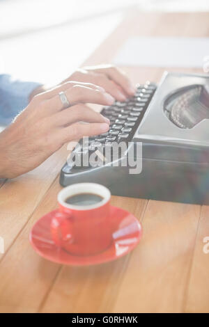Hipster using type writer Stock Photo - Alamy