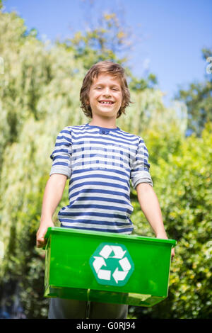 a boy holding a box Stock Photo - Alamy